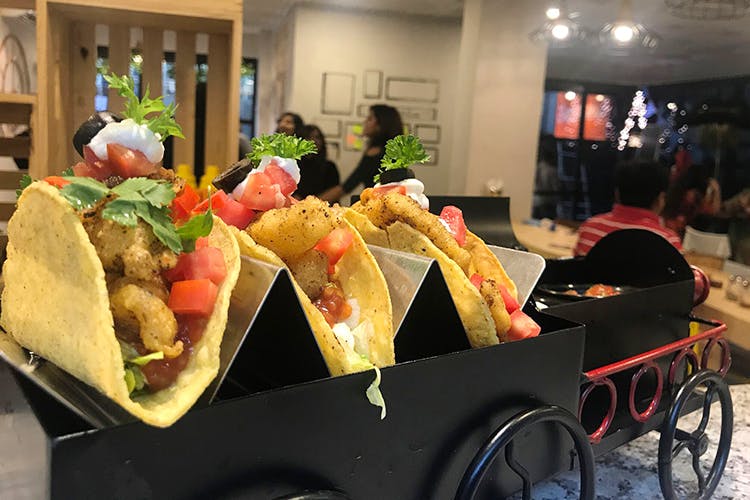 This New Cafe Has Pretty All-White Interiors & Spanish Churros You'll ...